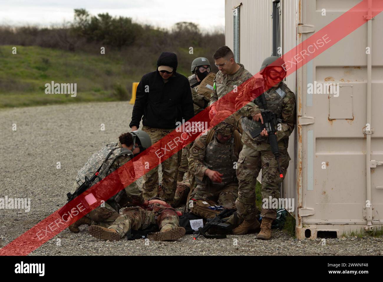 U.S. Airmen render aid to a simulated patient during a Tactical Combat ...