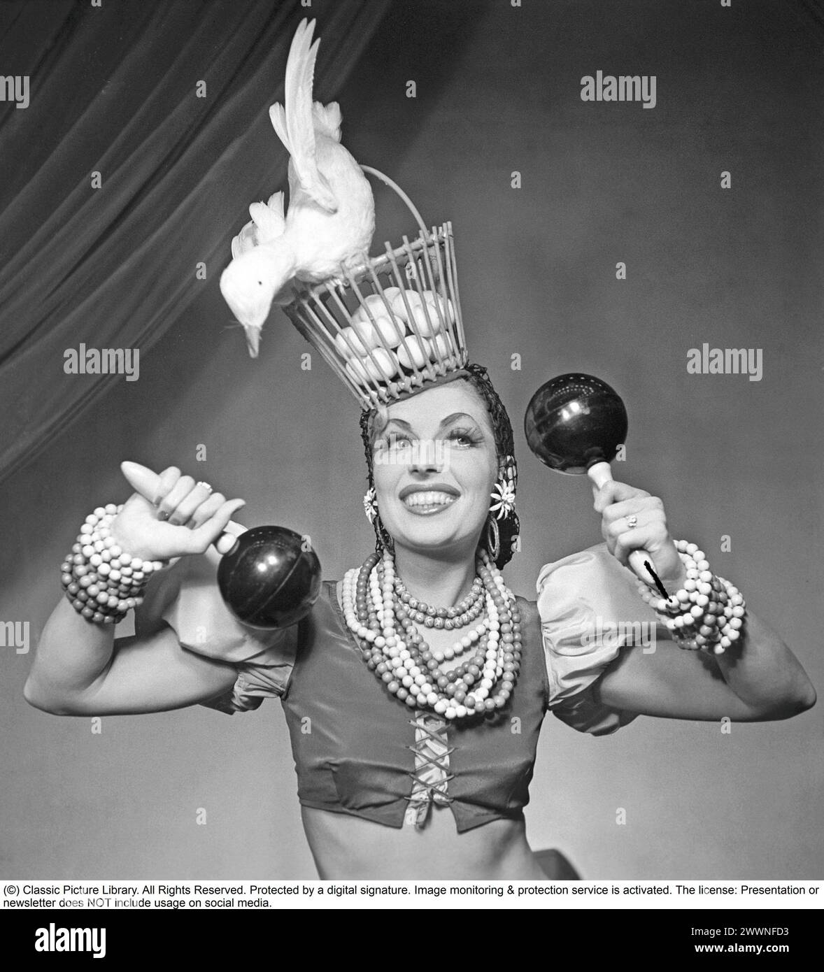 Showgirl in the 1940s. A beautiful looking actress and dancer pictured on the theater stage ...