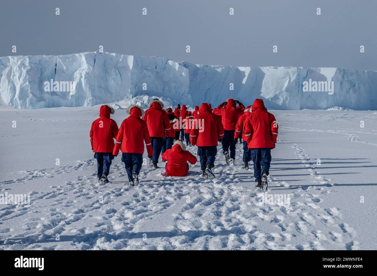 A crewmember from the Coast Guard Cutter Polar Star (WAGB 10) slides ...