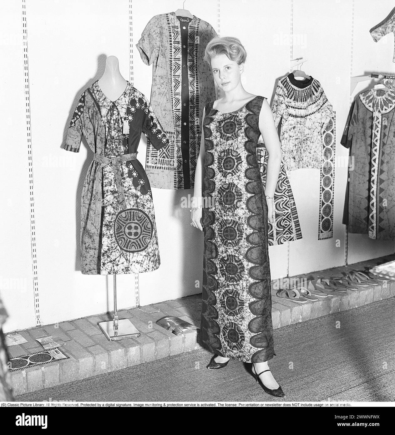 In the 1960s. A fashion model in a typical 1960s batik dress. 1964 ref ...