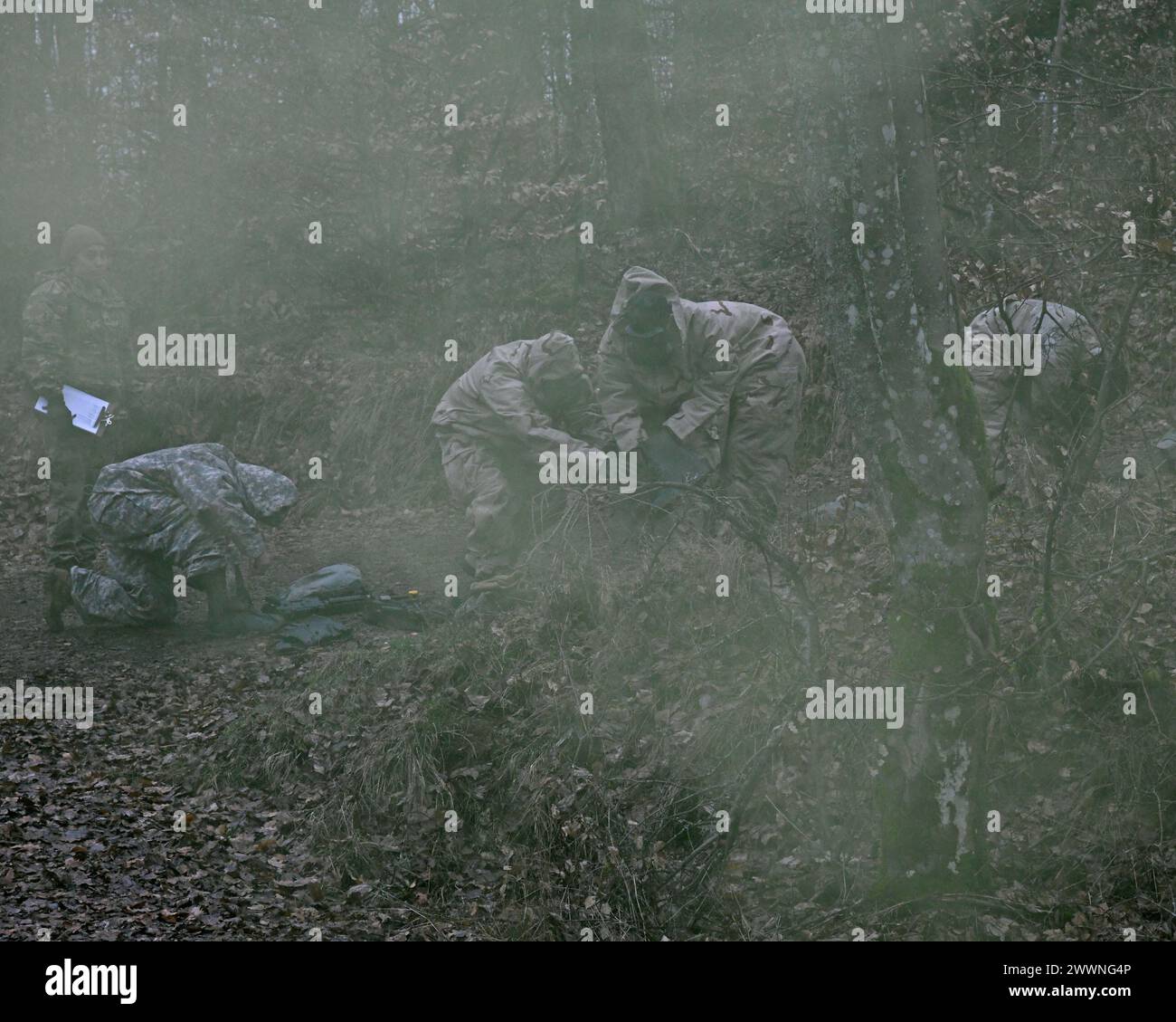 U.S. Army Medics from Medical Readiness Command, Europe, enter the NBC ...