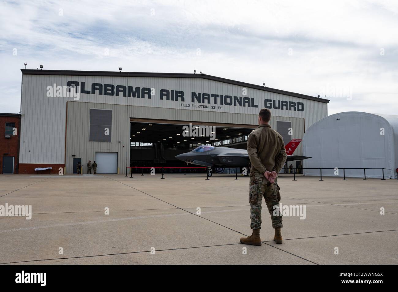 A U.S. Air Force Airman from the 187th Fighter Wing stands in a ...