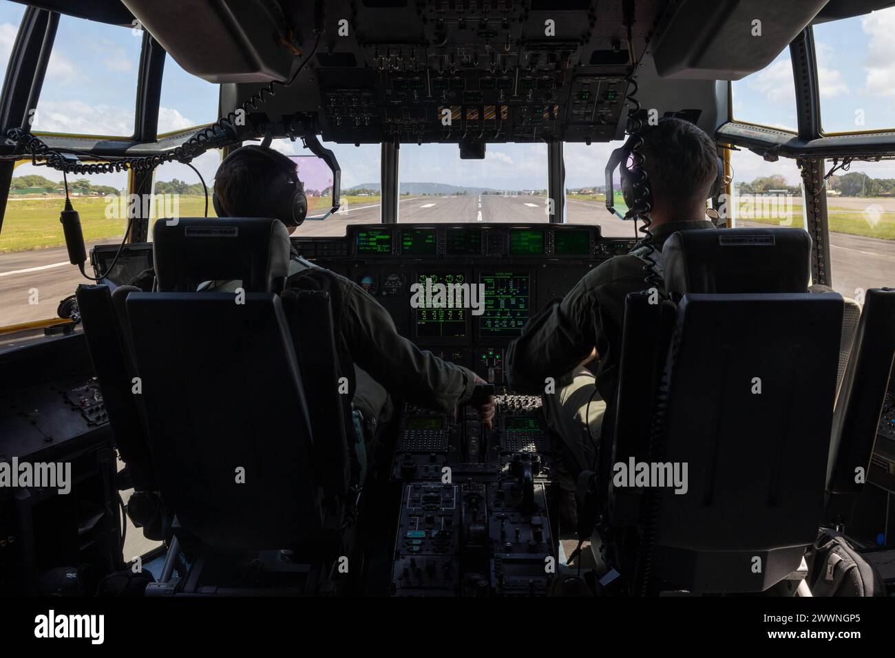 U.S. Marines Corps Capt. Aaron Royer, left, an aircraft commander, and ...