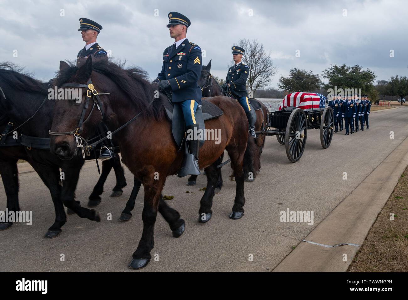The Fort Sam Houston Caisson Section carry the flag-draped casket of ...