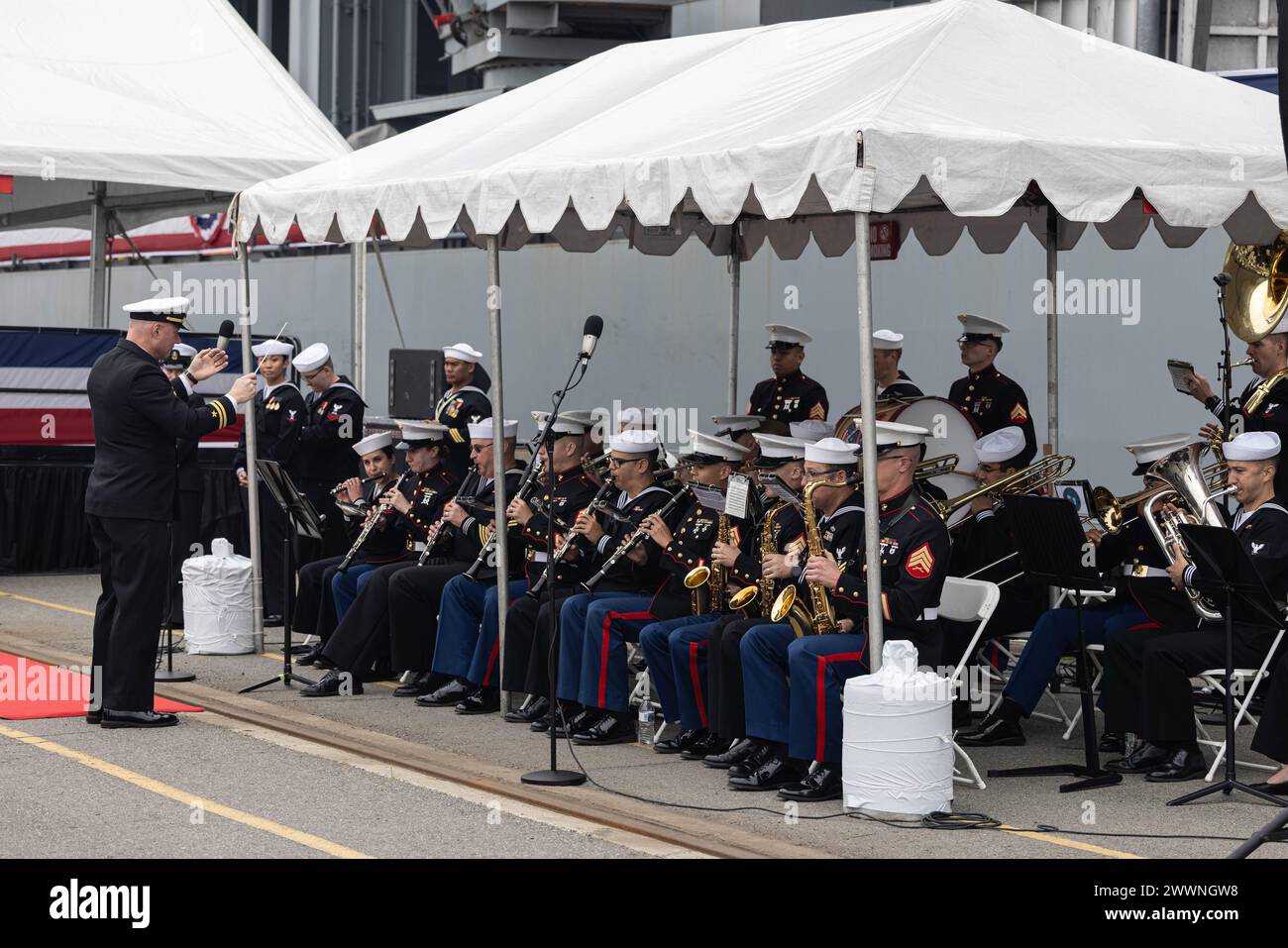 U.S. Marines with the 1st Marine Division Band and U.S. Sailors perform ...