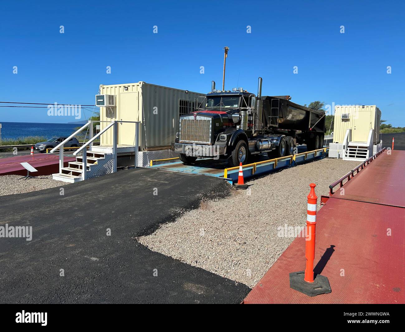 U.S. Army Corps of Engineers contractors haul ash and debris in plastic ...