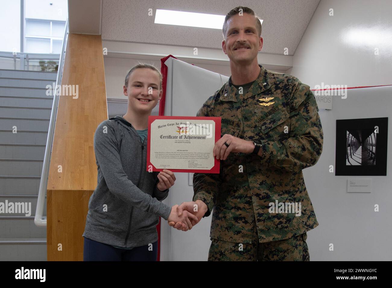 A student from Matthew C. Perry Middle School, left, poses for a ...