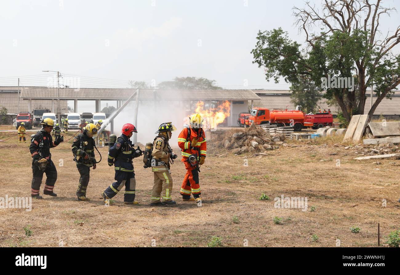Firefighters from the participating countries conduct fire training ...