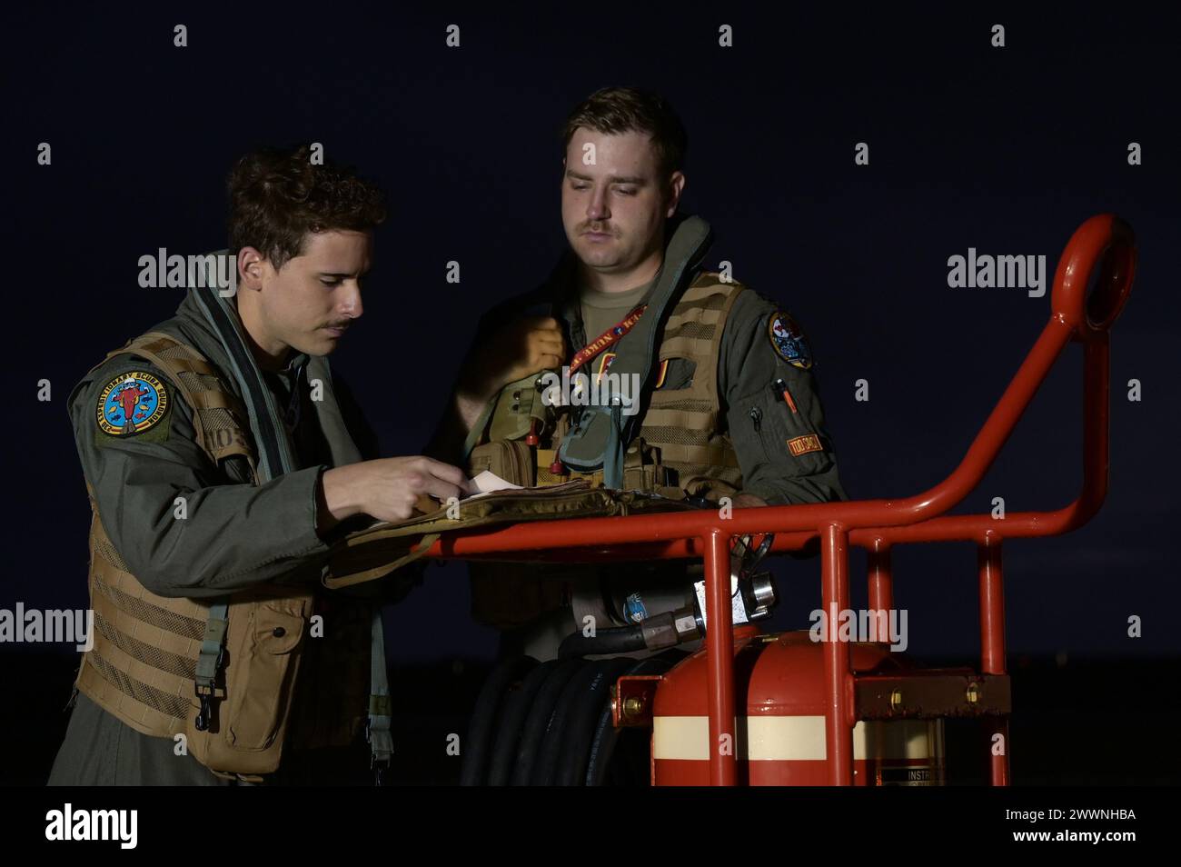U.S. Air Force Capt. Mark Bozzo (left), pilot, and Capt. Steven Lawless ...