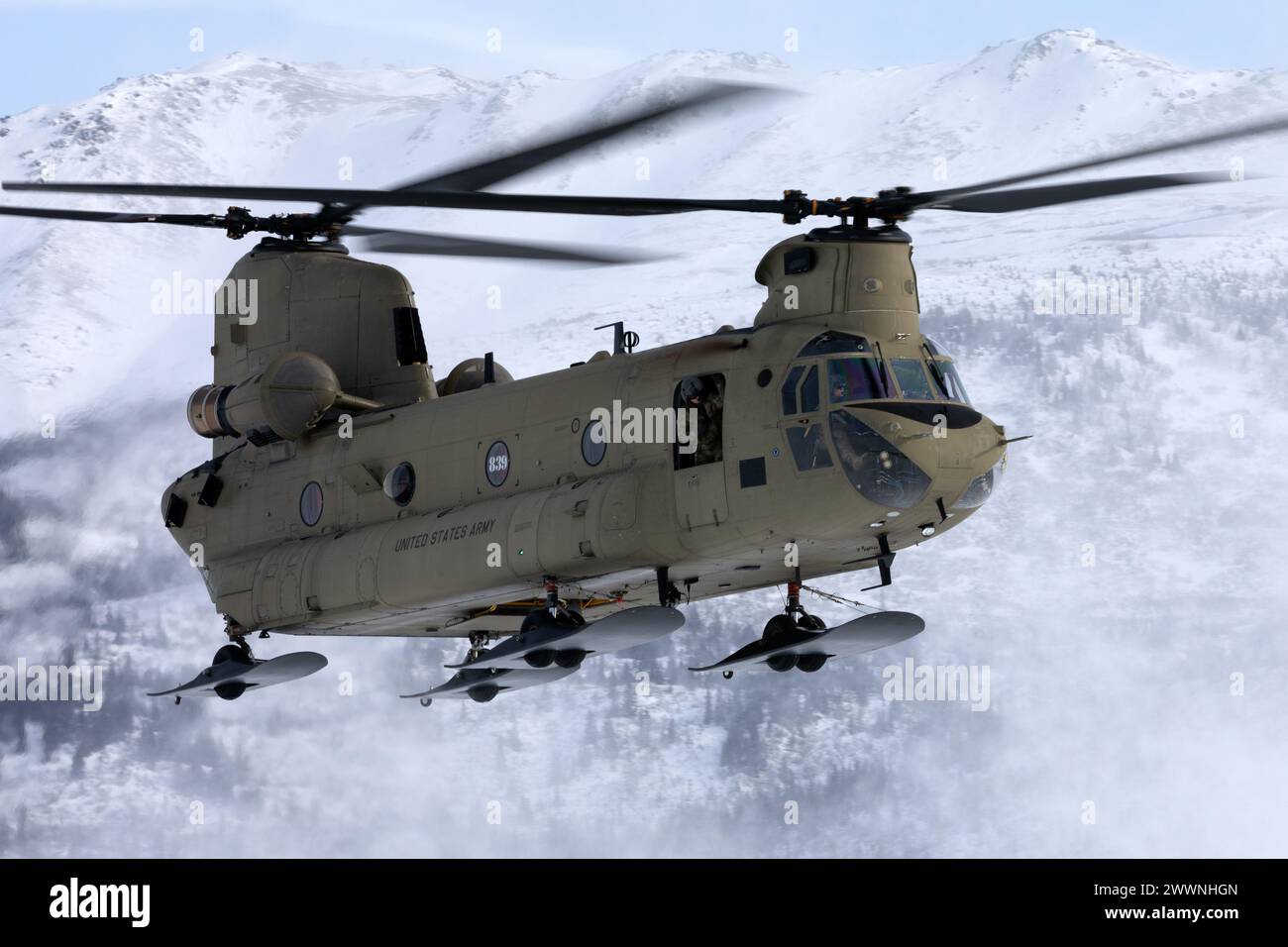 An Alaska Army National Guard CH-47F Chinook helicopter approaches a landing zone while ...