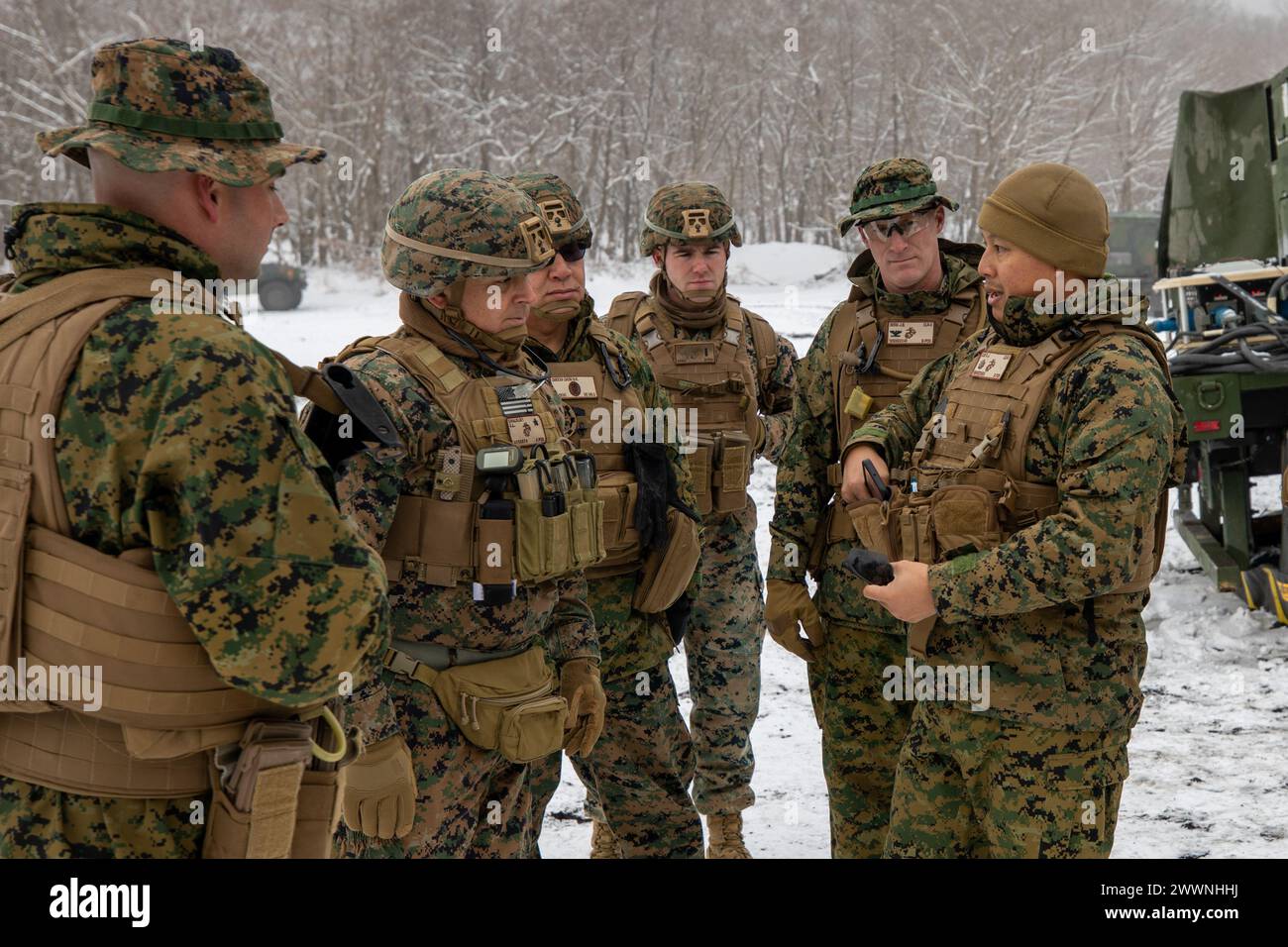 U.S. Marine Corps Maj. Kevin Lee, right, a communications officer with ...