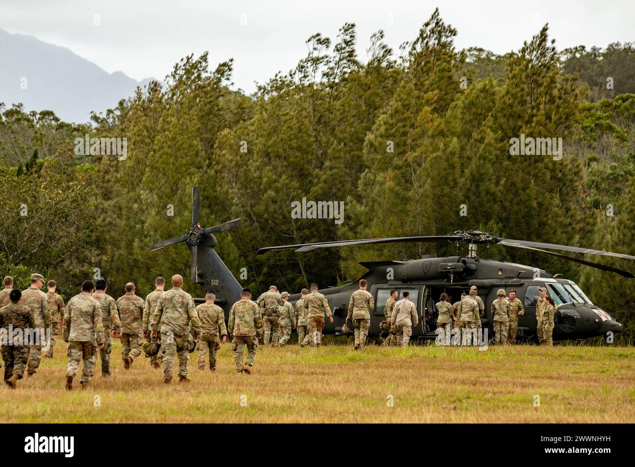 U.S. Army Soldiers walk toward a helicopter to receive training on how to properly medevac a ...