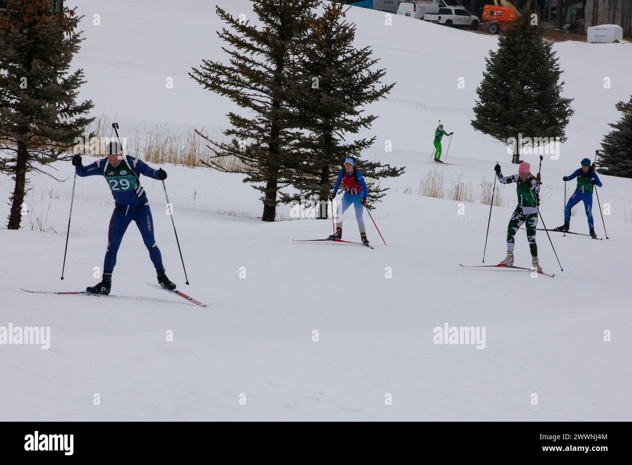 Members of the Army and Air National Guard climb an incline while ...