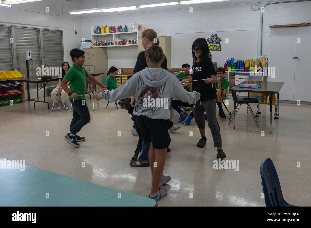 Students demonstrate a simulated satellite orbit during a presentation at Daniel Laynez Perez ...