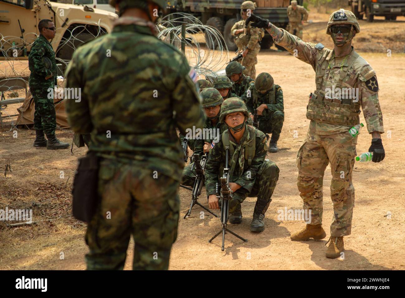 Soldiers of the Royal Thai Army prepare to enter the firing range for ...
