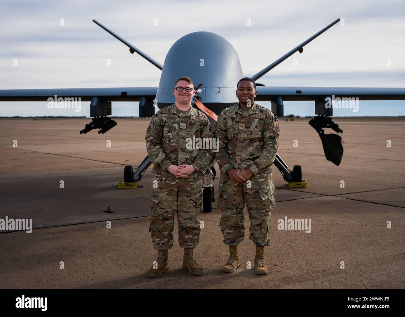 Airmen pose for a photo with a 27th Special Operations Wing MQ-9 Reaper following an African ...