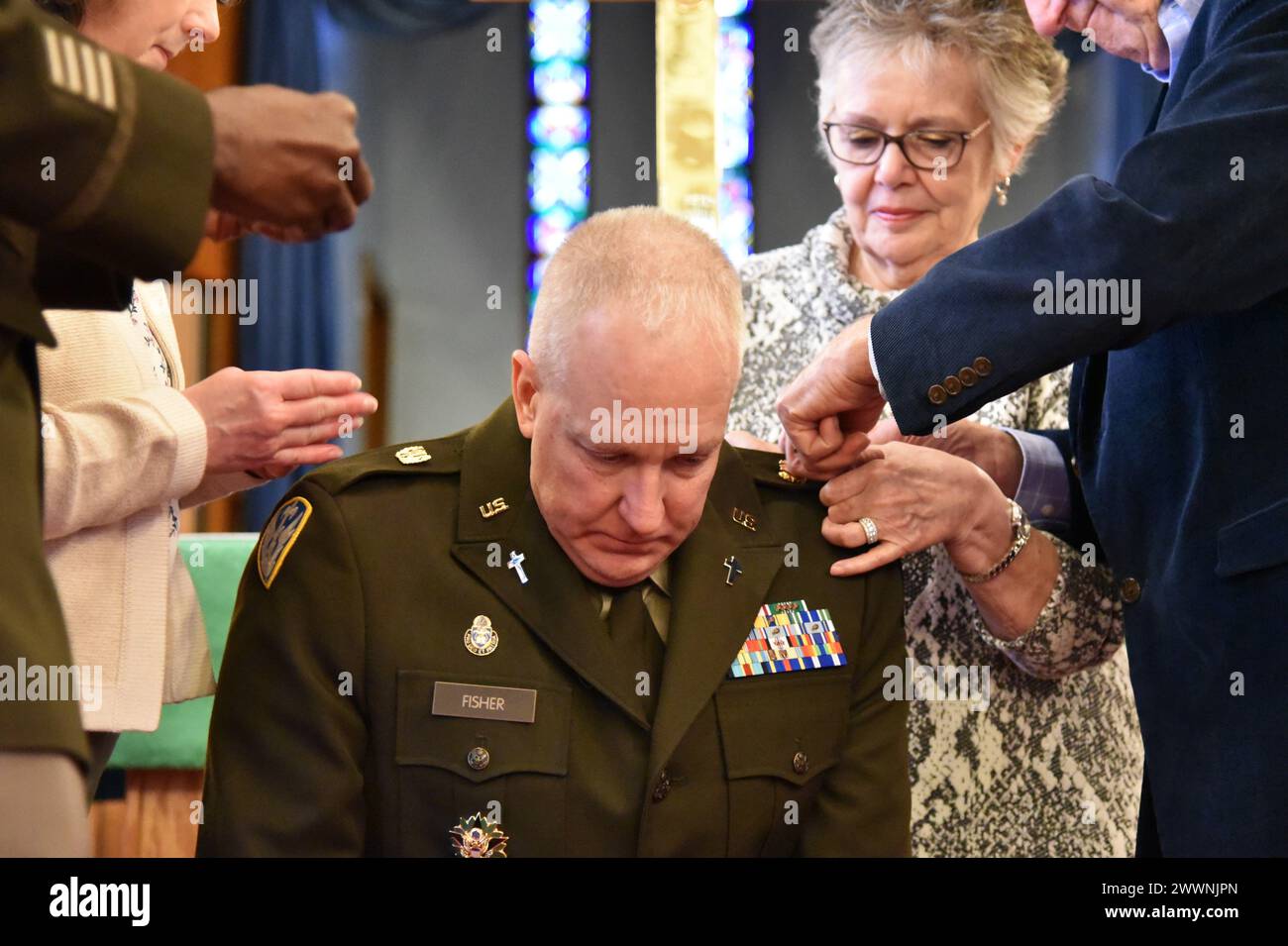 Chaplain James F. Fisher was promoted to colonel by Maj. Gen. William ...