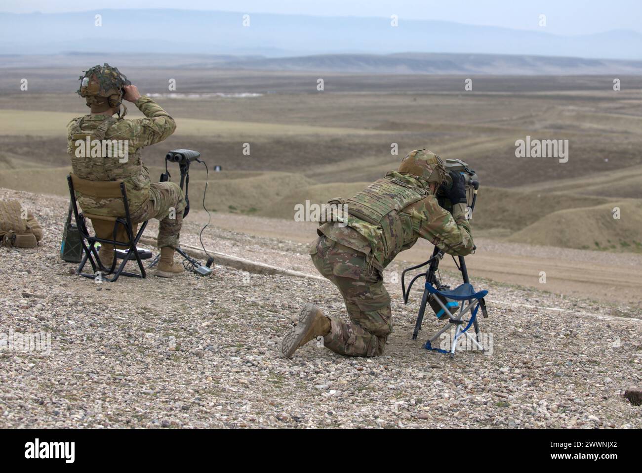 U.S. Army Spc. Neil Johnson, left, and Spc. Isaiah Webster, forward ...