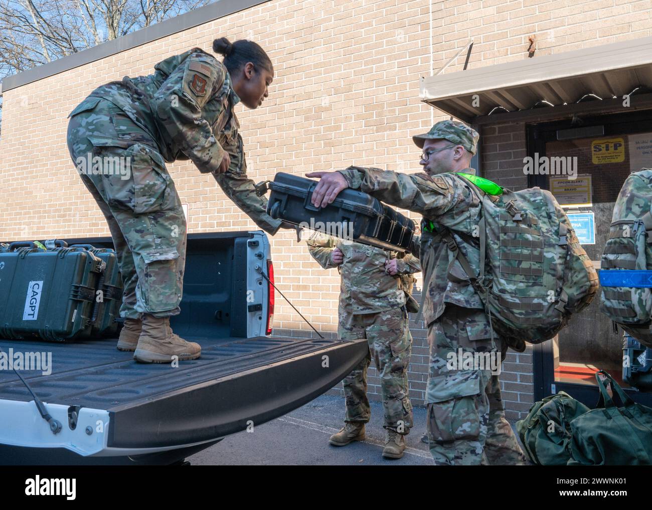 94th Security Forces Squadron members load cargo to be hauled off to ...