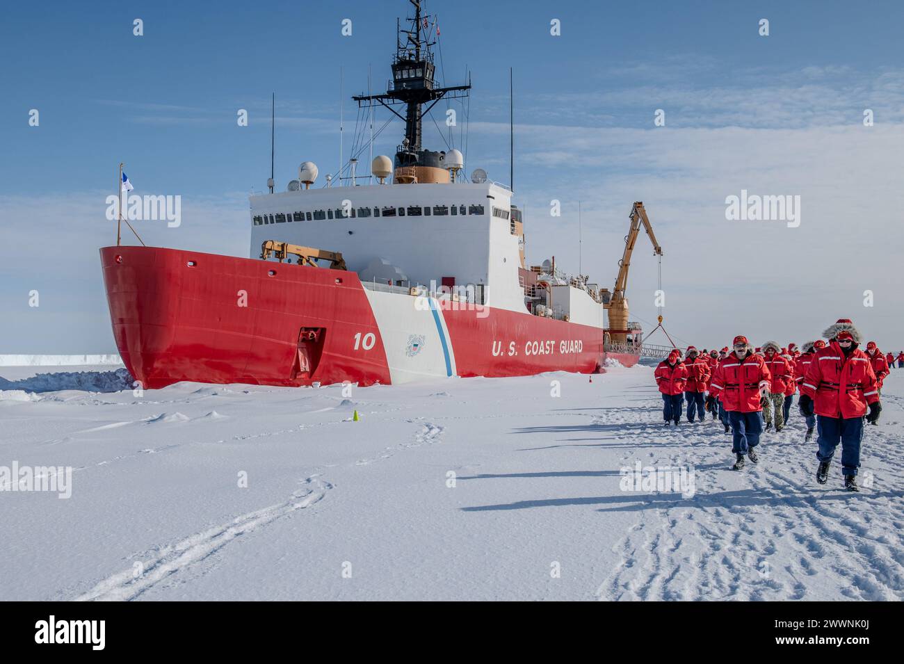 The crew of the U.S. Coast Guard Cutter Polar Star (WAGB 10) walks ...