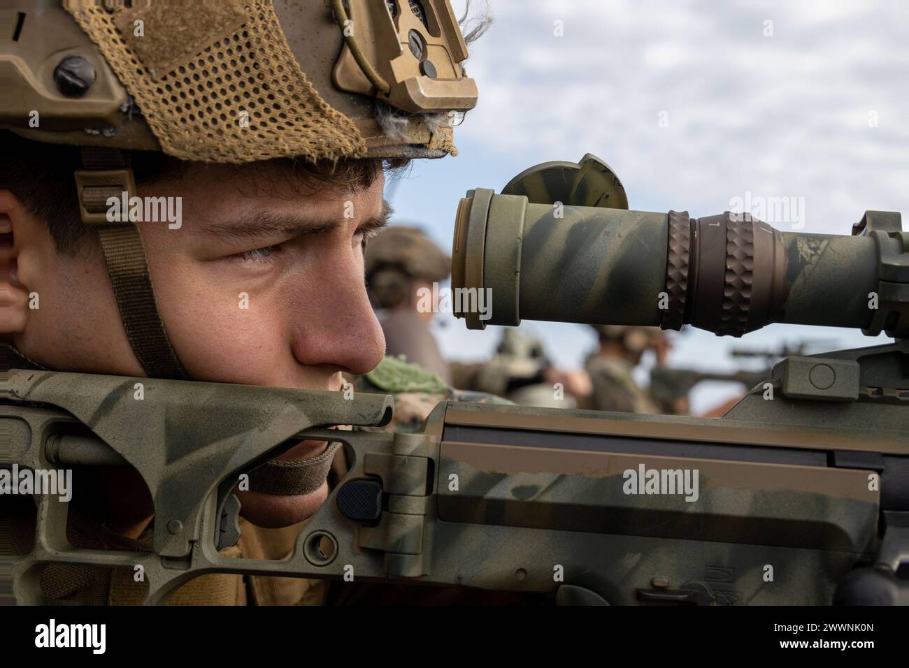 U.S. Marine Corps Sgt. Jesse McManigle, a scout sniper with Battalion Landing Team 1/1, 31st ...