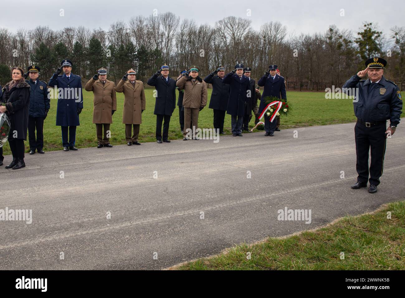 Polish police render salutes during a ceremony at Citadel Park in ...