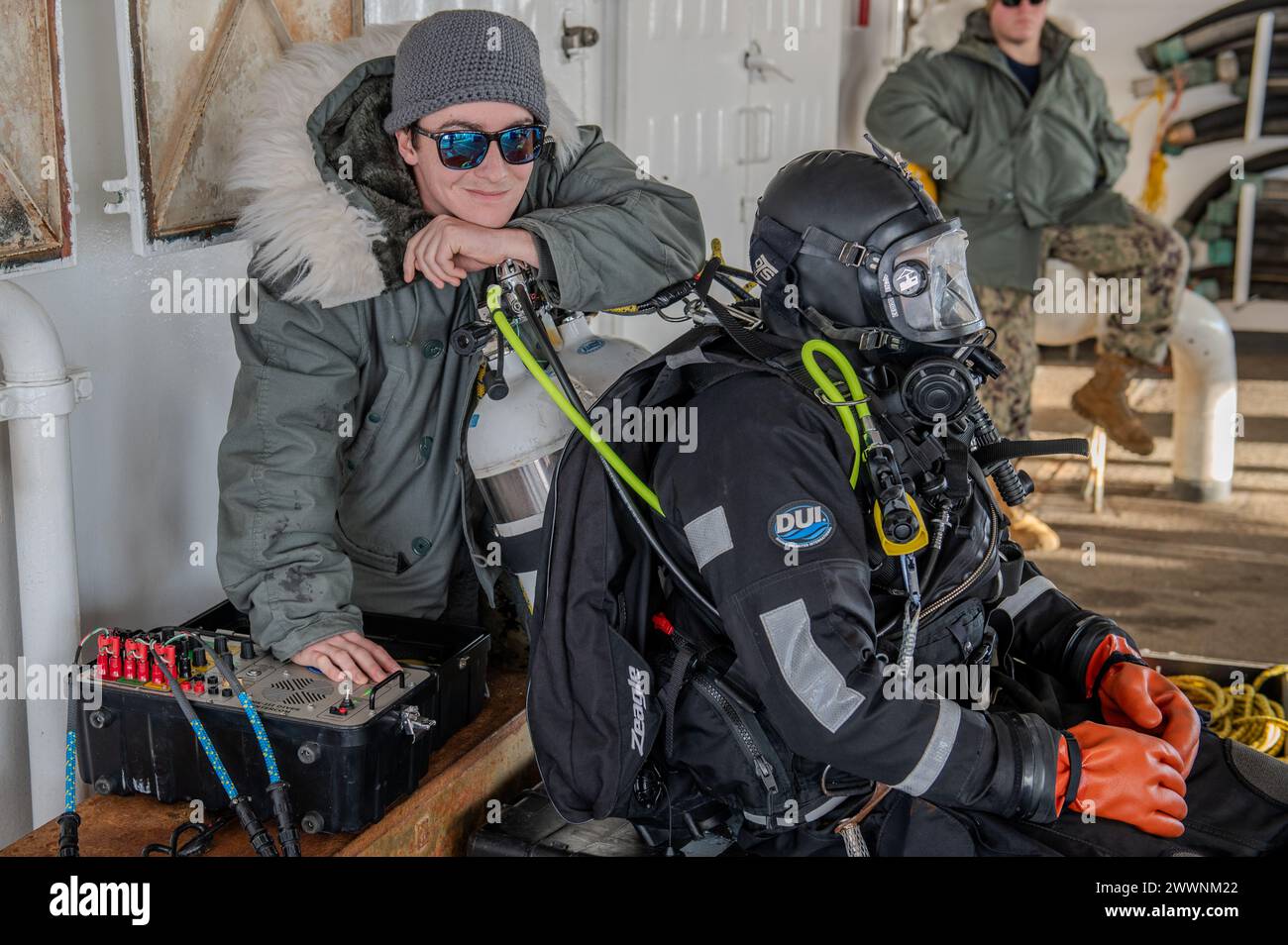 U.S. Navy Petty Officer 1st Class Chase Marini and U.S. Coast Guard ...