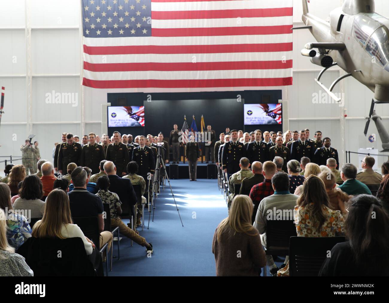 Flight school graduates turn and face the crowd as the U.S. Army ...