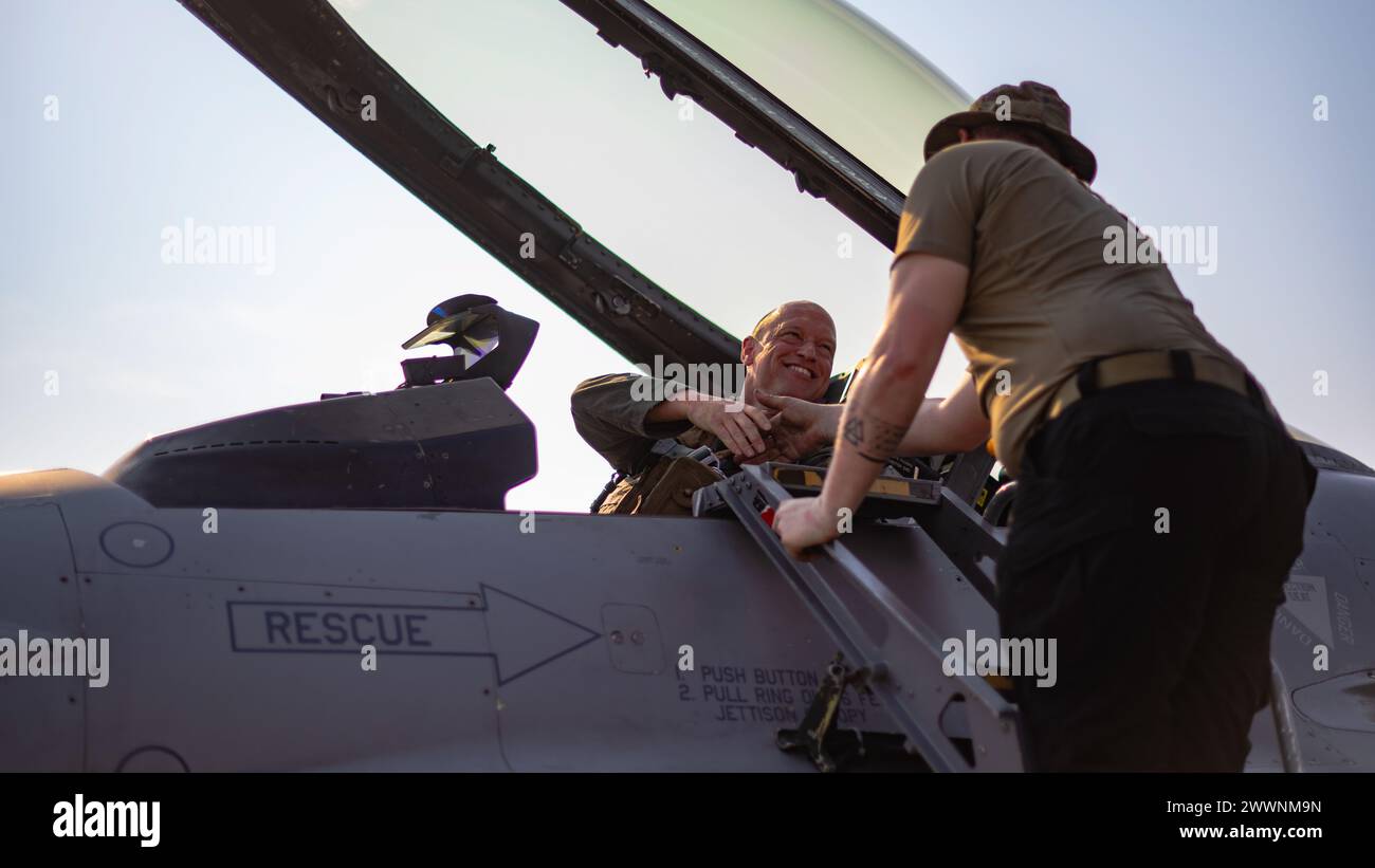 Col. Matthew C. Gaetke, left, 8th Fighter Wing commander, offers a ...