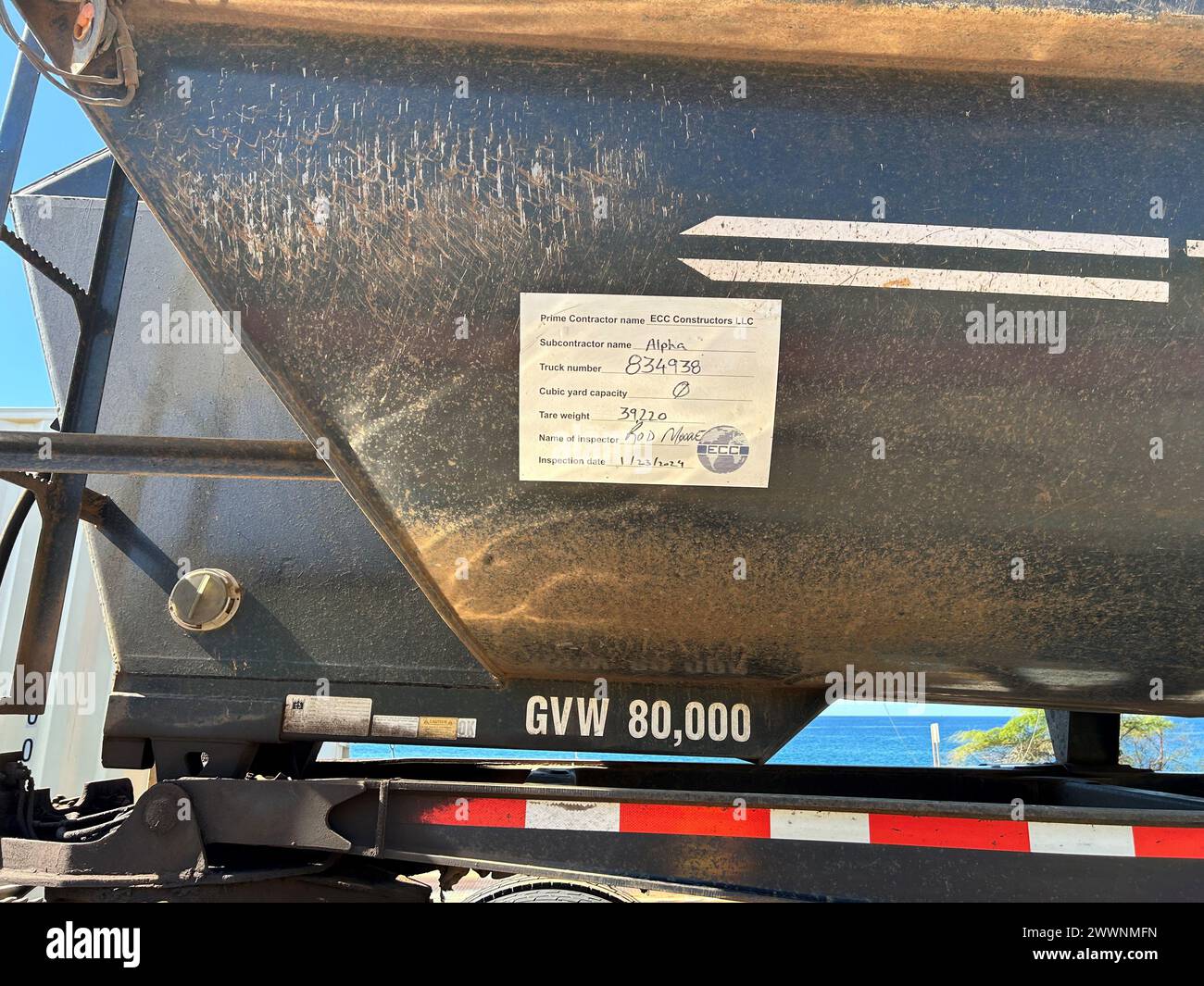 U.S. Army Corps of Engineers contractors haul ash and debris in plastic ...