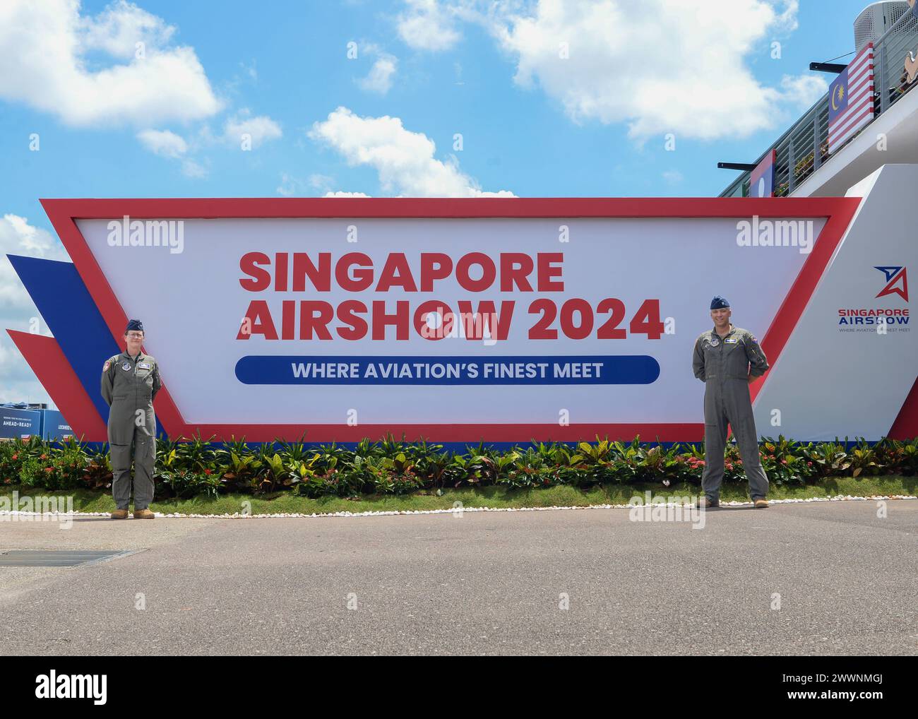 U.S. Air Force Col. Joanna Mitchell, left, Air Boss for the Singapore Airshow 2024, stands with ...