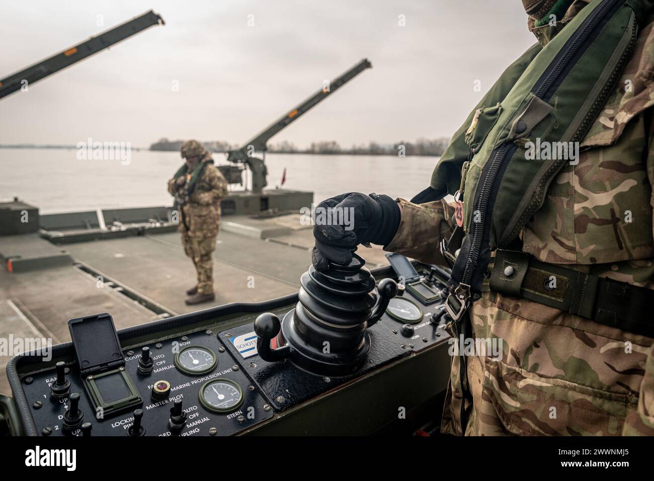 Photo Description: A German soldier navigates an amphibious rig during ...