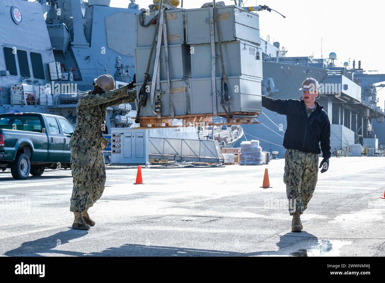 U.S. Navy Equipment Operator 3rd Class Charles Mathenge, left, and ...