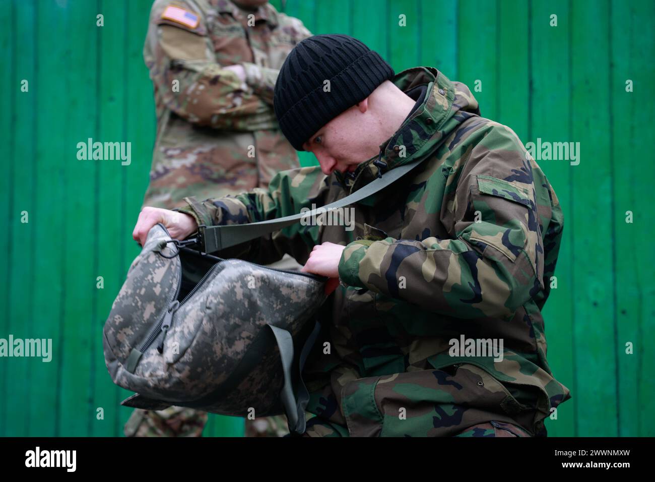 Moldovan Soldat Classa III Vlad Mocanu, medic, Brigade 3, searches for ...