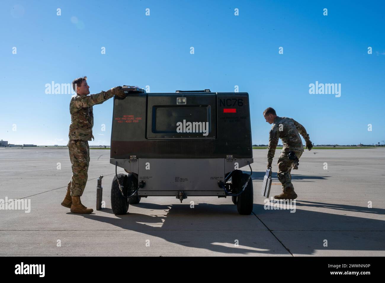 Airman 1st Class Jackson Call, left, and Senior Airman William Dugger ...
