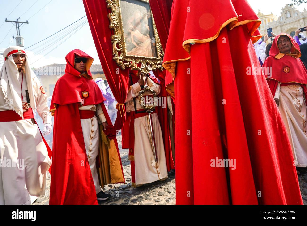 Antigua, Guatemala. 24th Mar, 2024. Penitents prepare to lead a massive ...