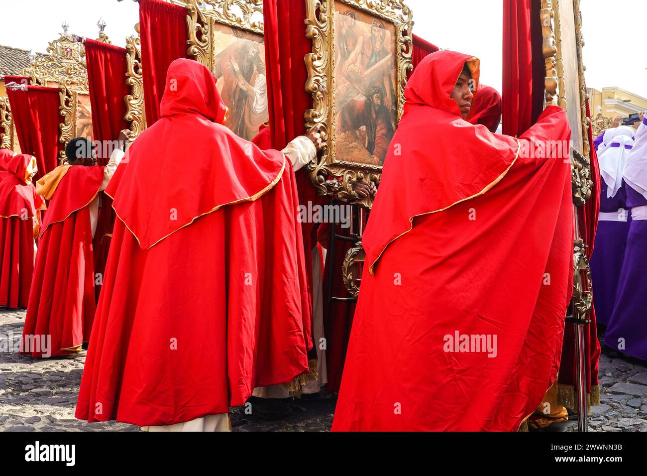 Antigua, Guatemala. 24th Mar, 2024. Penitents prepare to lead a massive ...
