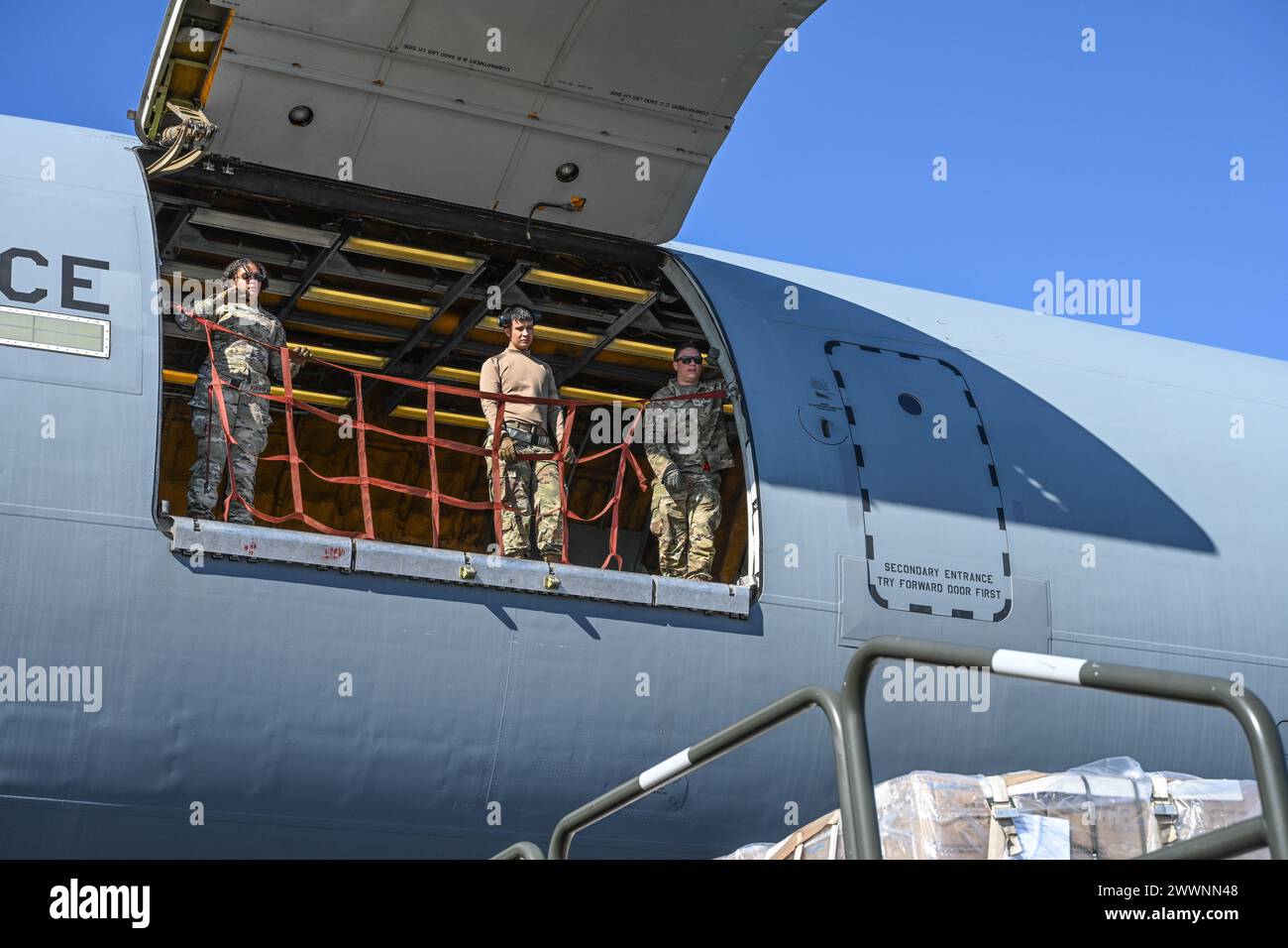 Airmen assigned to the 19th Logistics Readiness Squadron watch as a K ...