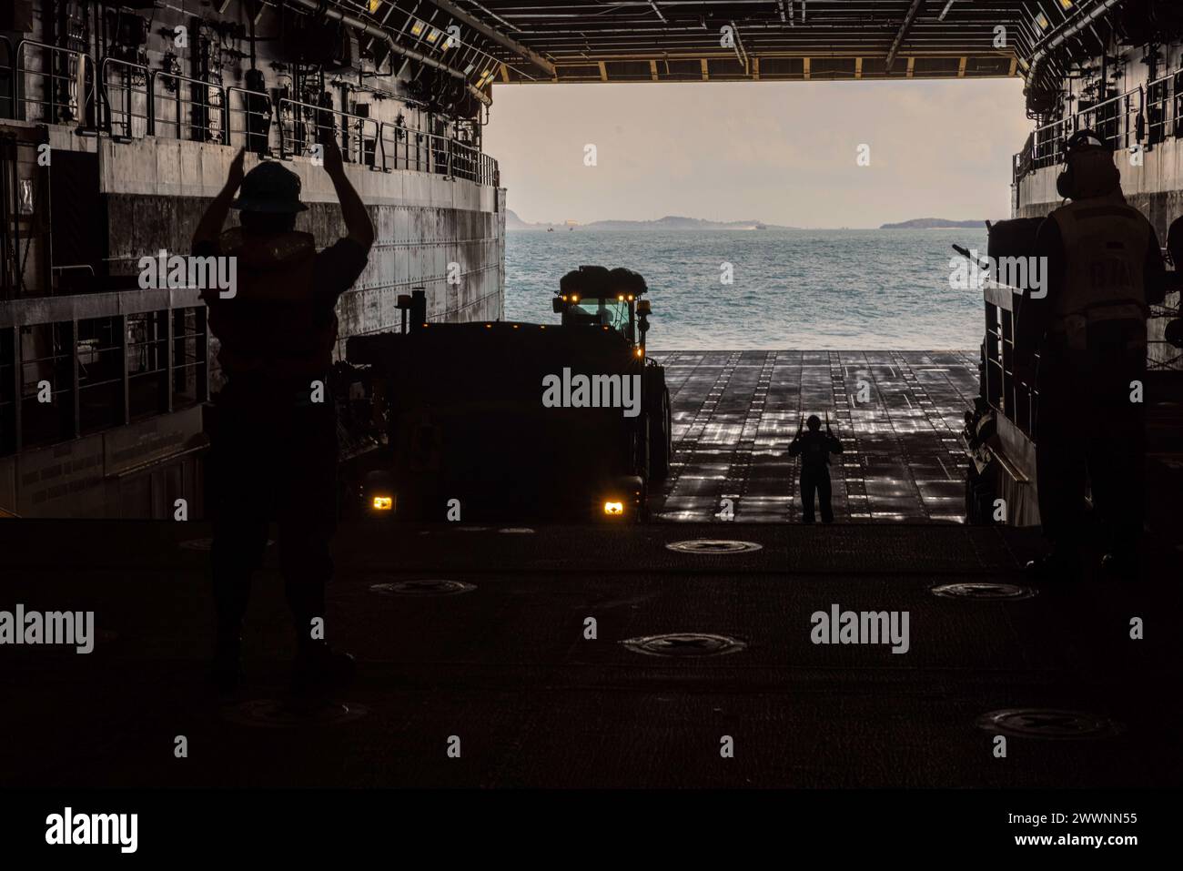 U.S. Marines and Sailors assigned to the amphibious transport dock USS ...