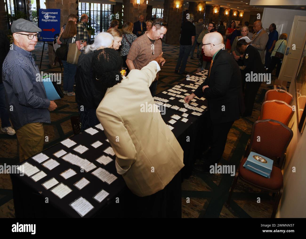 Defense POW/MIA Accounting Agency (DPAA) personnel sign in family ...