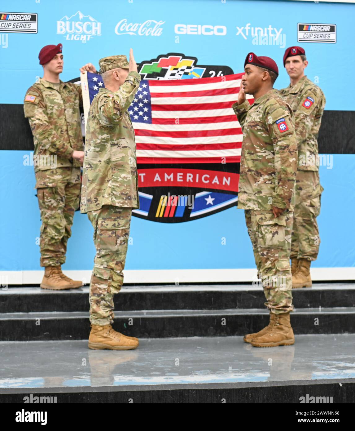 Staff Sergeant William Ford recites the oath of reenlistment from ...
