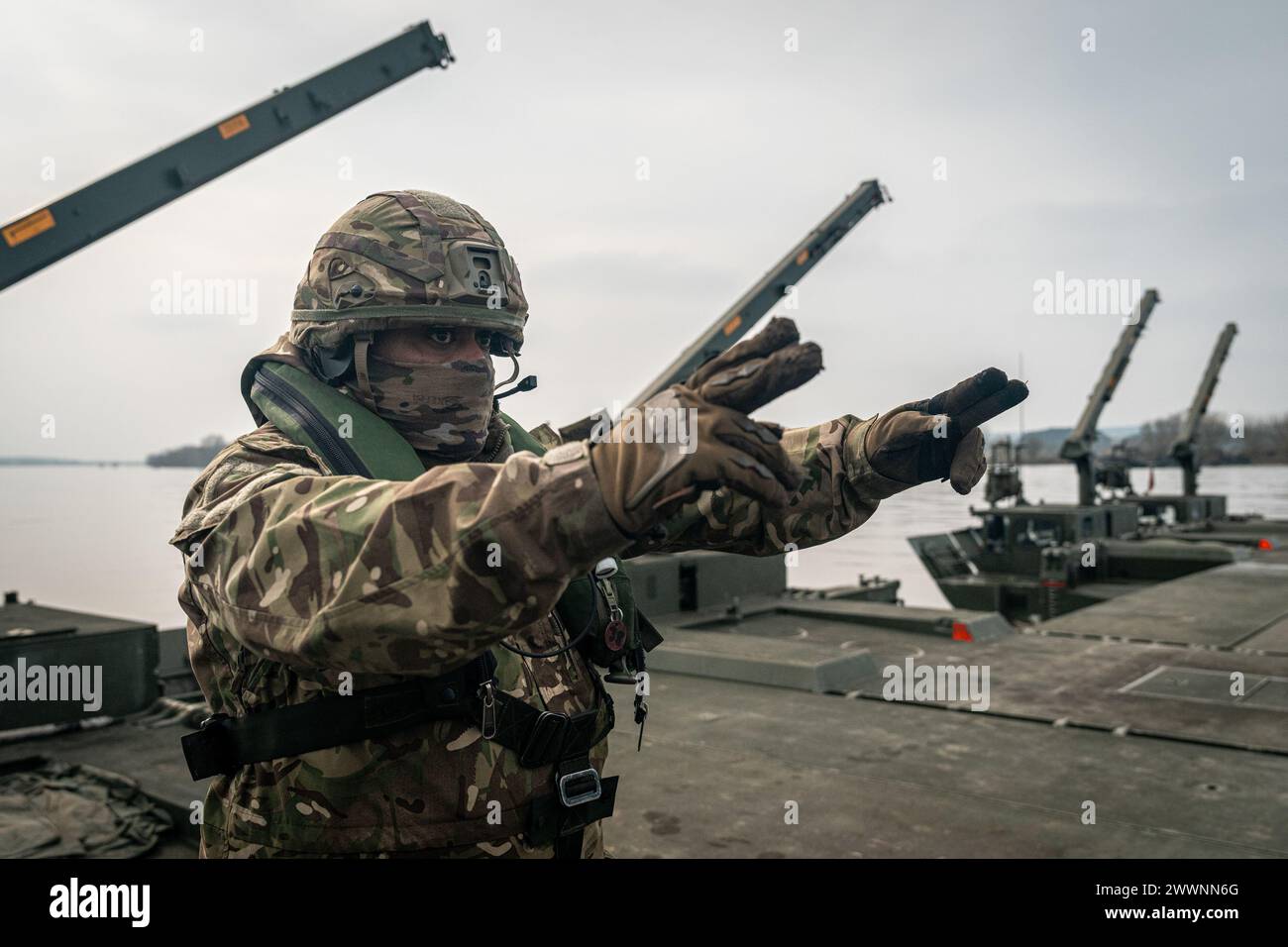 Photo Description: A German soldier gives directions to his crew of an ...