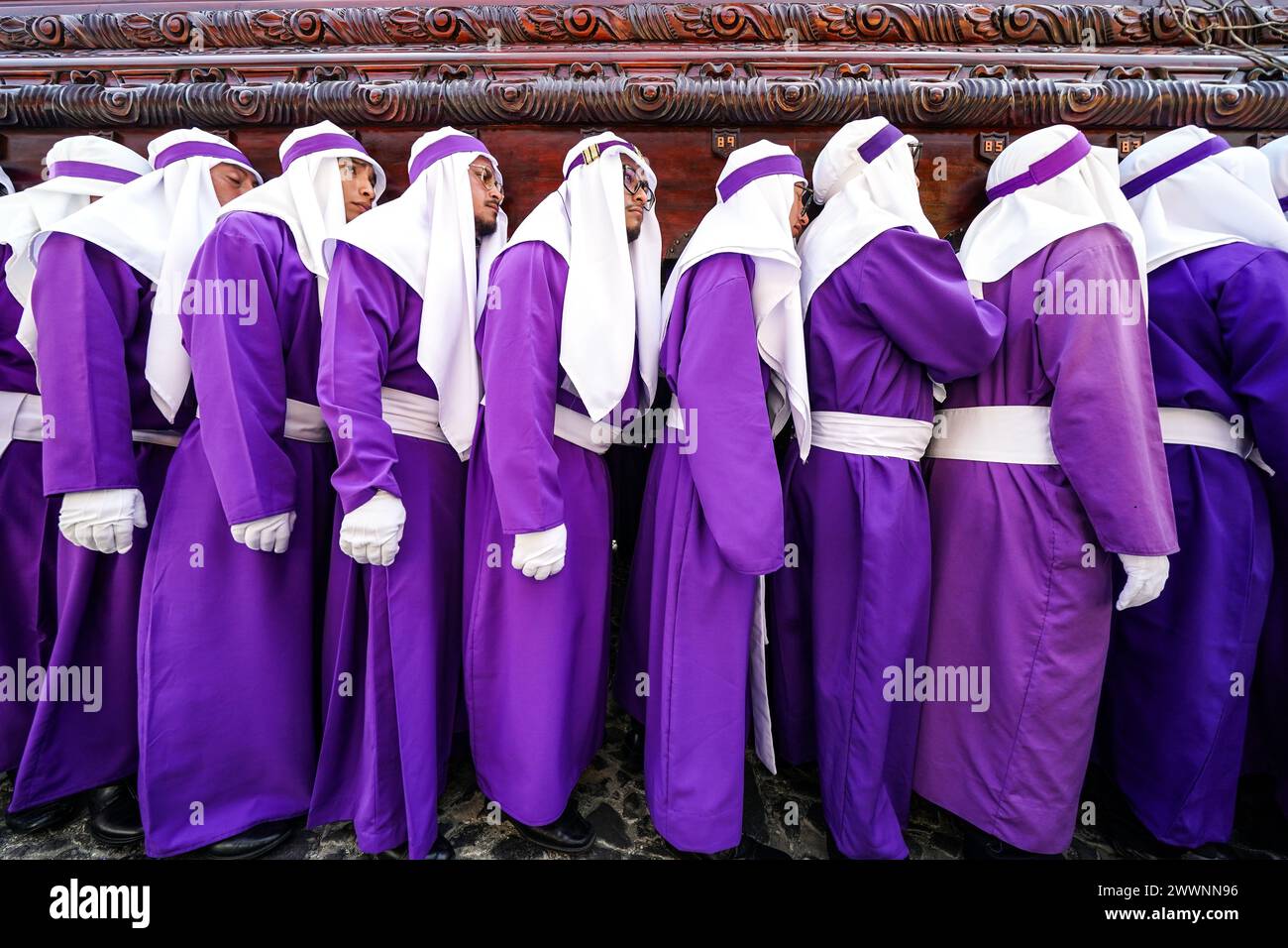Antigua, Guatemala. 24th Mar, 2024. Catholic penitents packed together ...