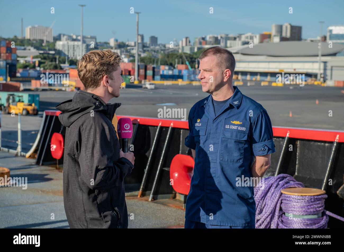 U.S. Coast Guard Capt. Keith Ropella, commanding officer, gives a live ...