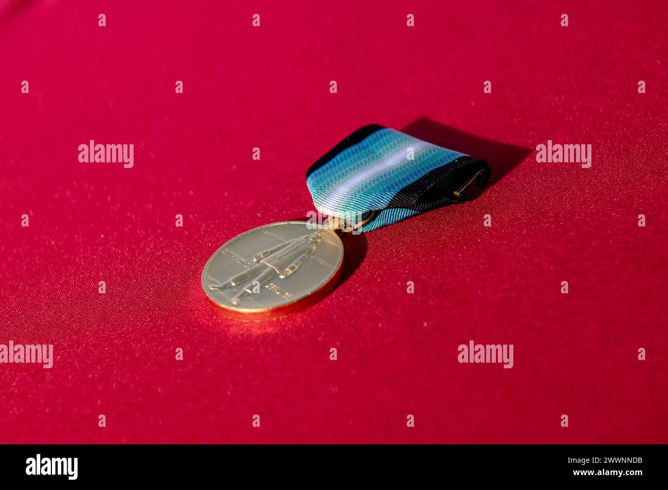 An Antarctica Service Medal lies on a table before being presented to a ...