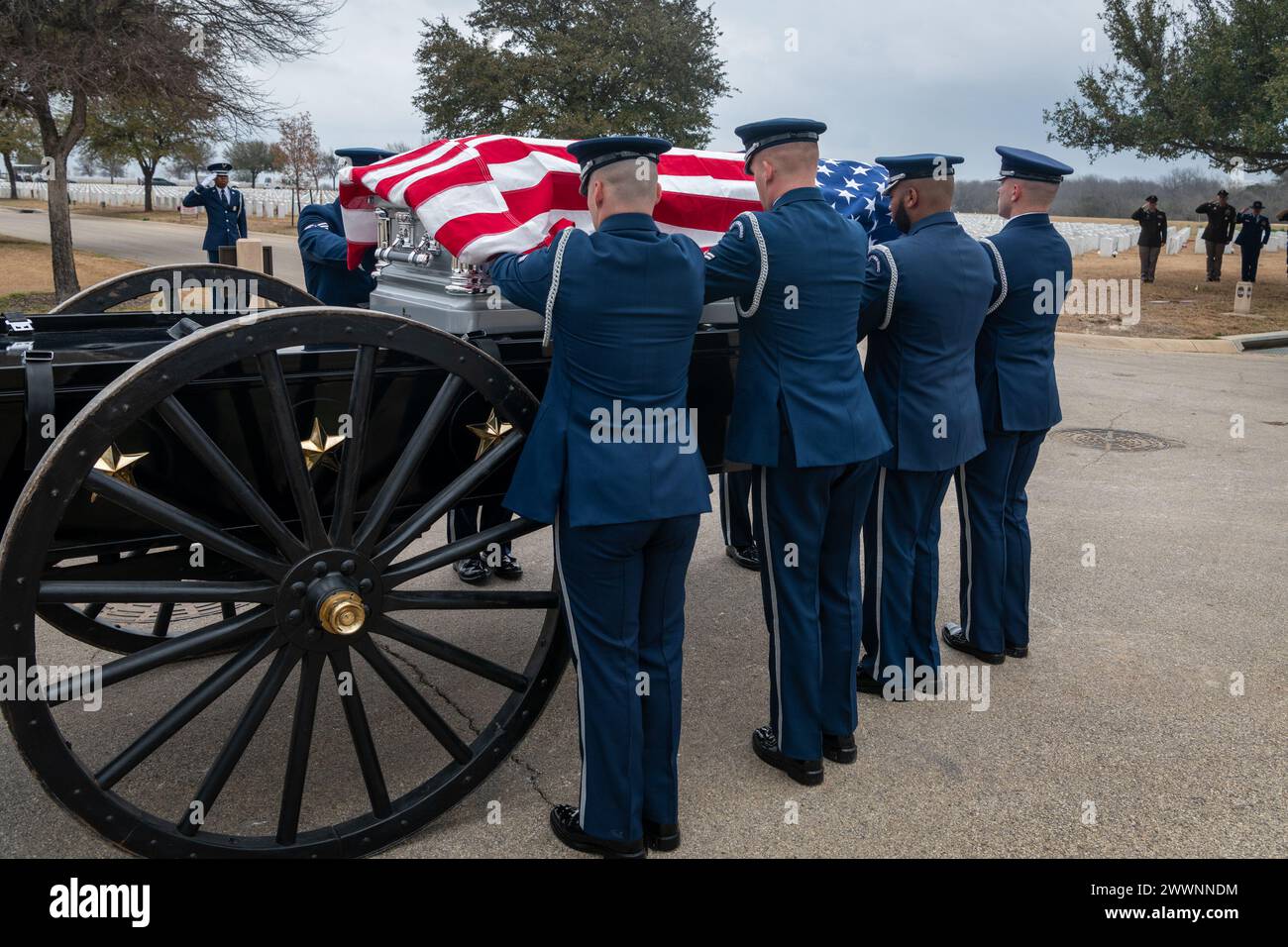The U.S. Air Force Honor Guard pallbearer team carry the casket of ...