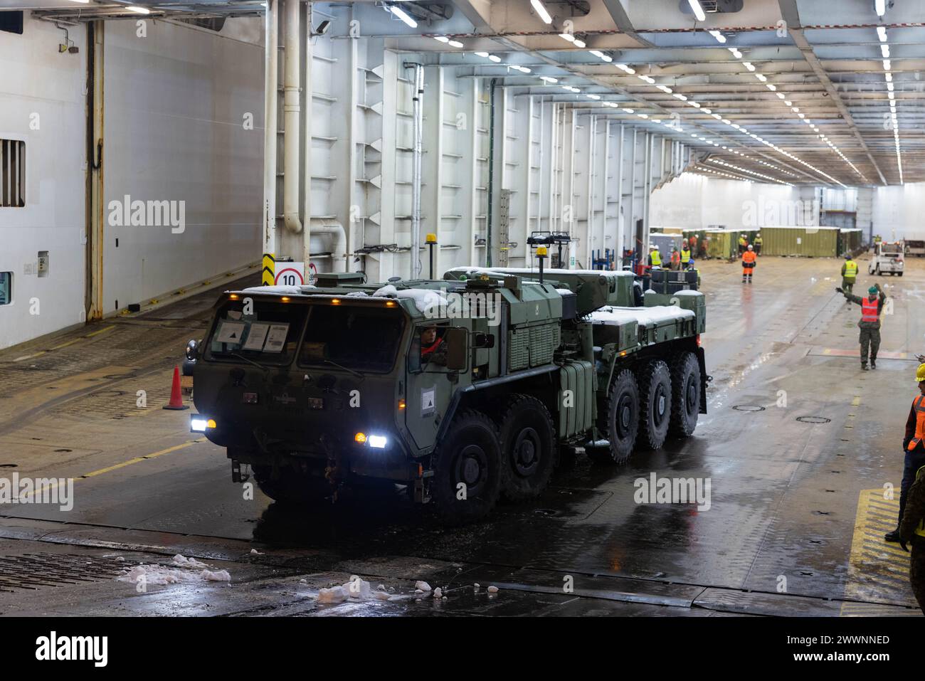 U.S. Marines with Arrival and Assembly Operations Group (AAOG), load a ...