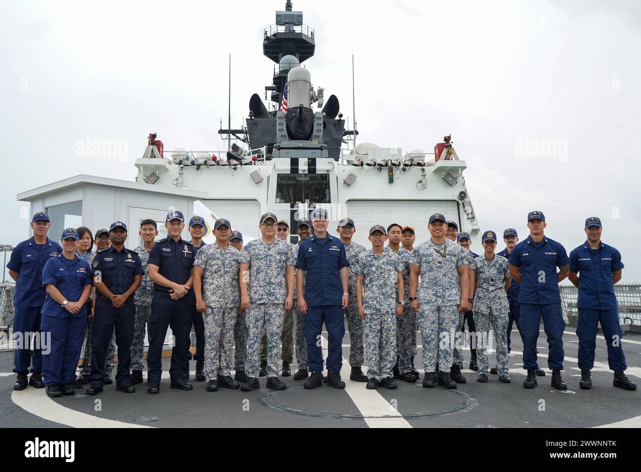 Crewmembers from U.S. Coast Guard Cutter Bertholf (WMSL 750) stand with ...