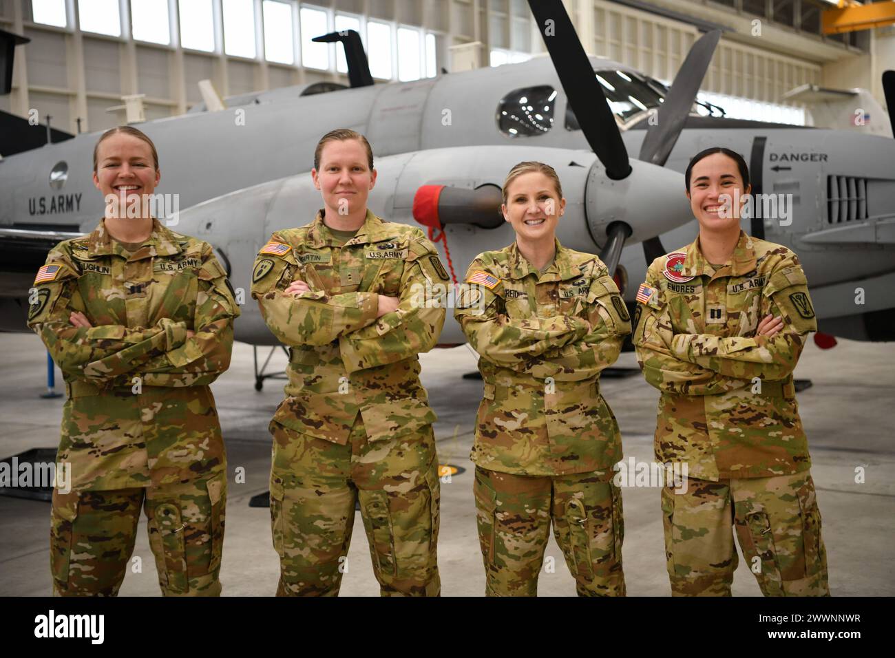 (from left) Capt. Alaina McLaughlin, commander of Company B, 3rd Military Intelligence Battalion ...