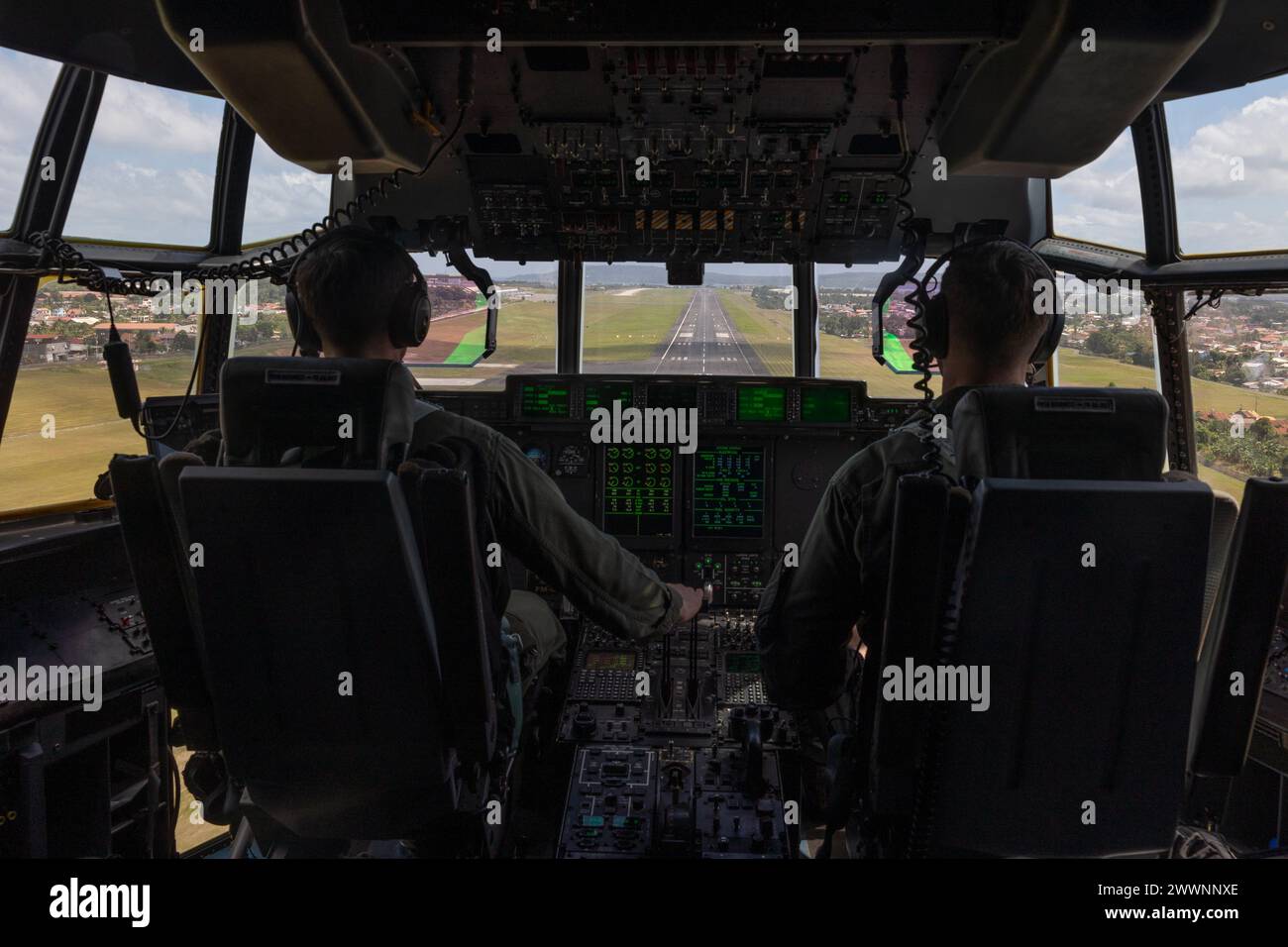 U.S. Marines Corps Capt. Aaron Royer, left, an aircraft commander, and ...